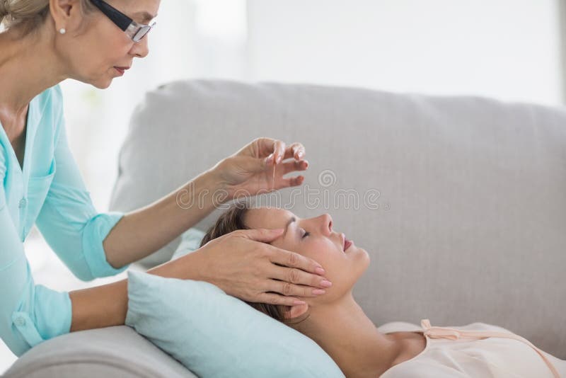 Woman Receiving Acupuncture Treatment Stock Photo - Image of indoors ...