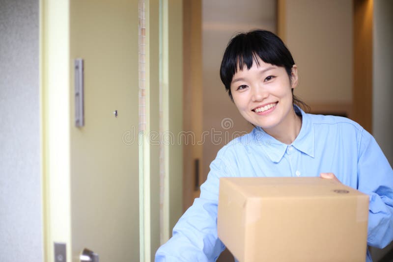 Woman receiving courier stock image. Image of transportation - 244462087