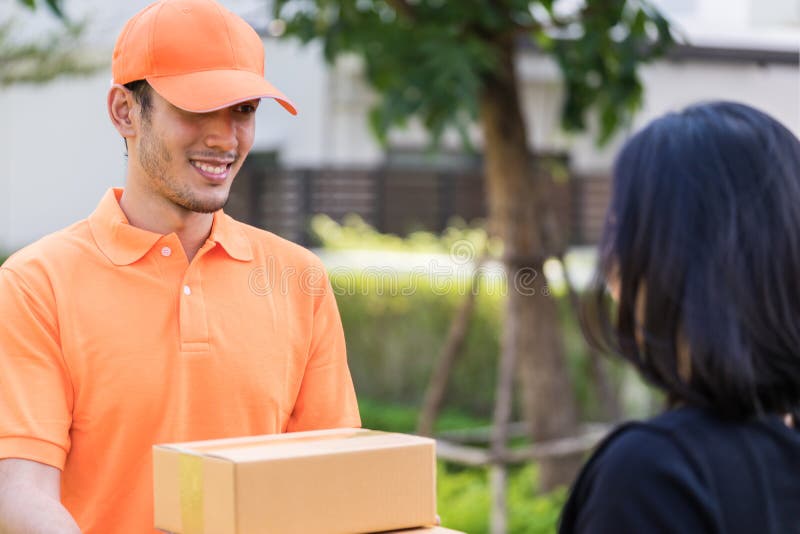 Woman Receiving Delivery of Box from Delivery Man Stock Photo - Image ...