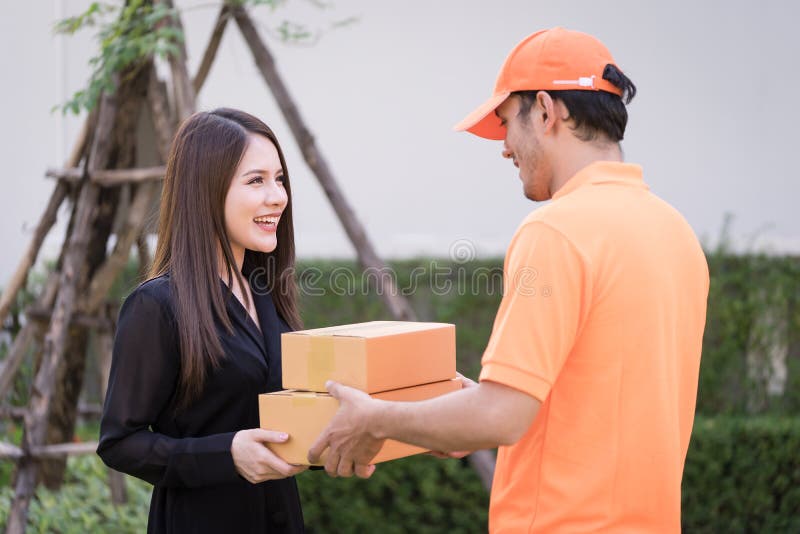 Woman Receiving Delivery Box from Delivery Man Stock Photo - Image of ...