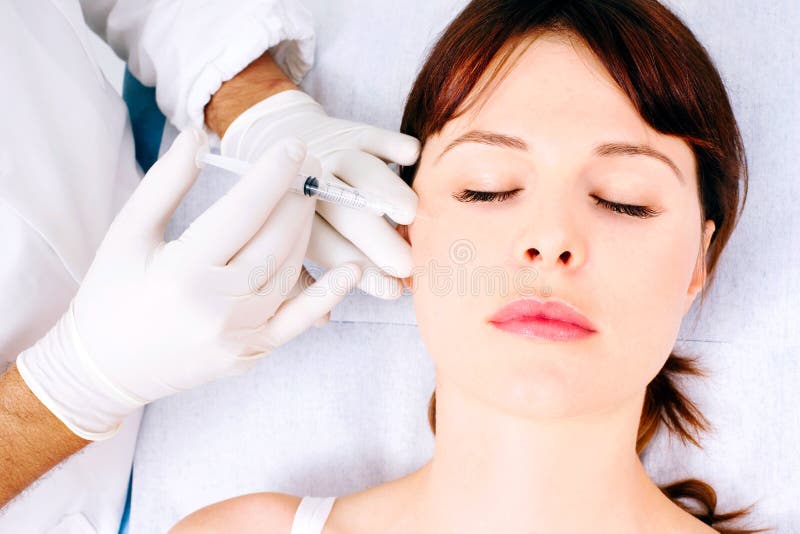 Woman Receiving an Injection of Botox from a Docto Stock Image - Image ...