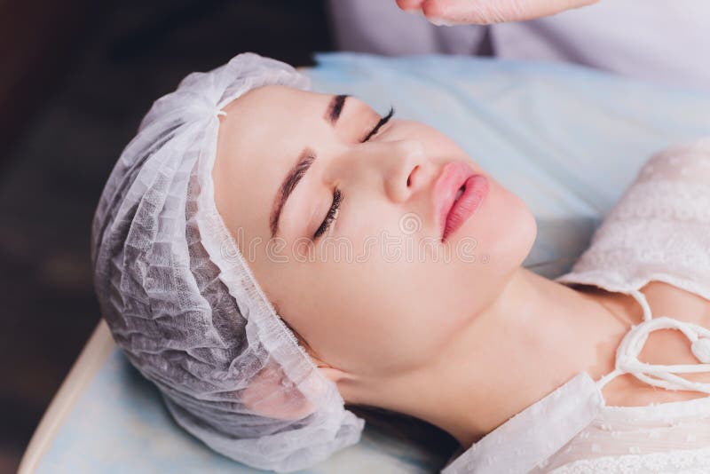 Woman Receiving a Injection in Her Lips, Close Up. Stock Image - Image ...