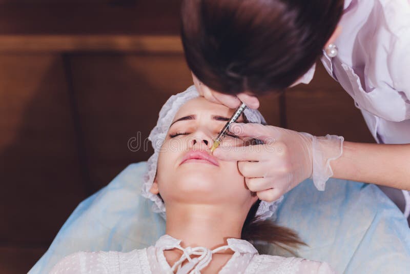 Woman Receiving a Injection in Her Lips, Close Up. Stock Image - Image ...