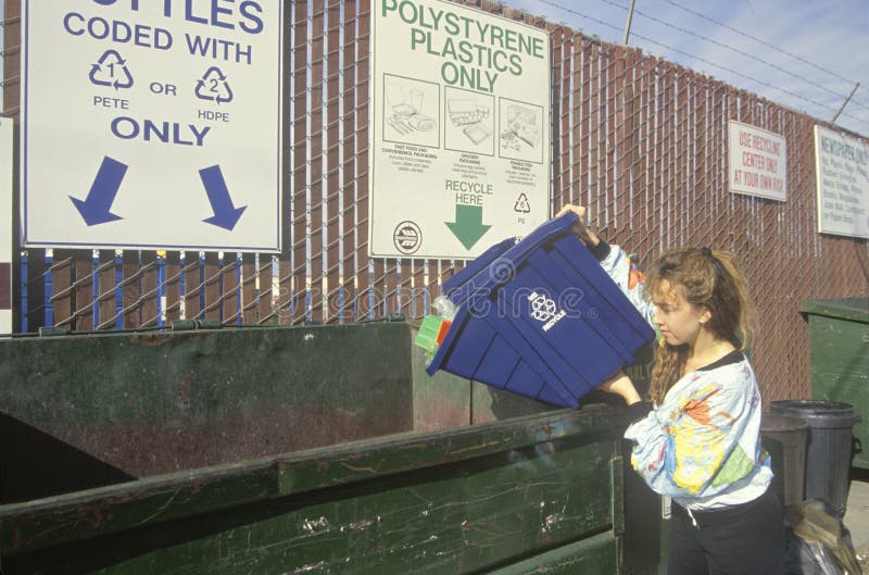 A woman recycling plastics editorial photo. Image of environmentalist ...
