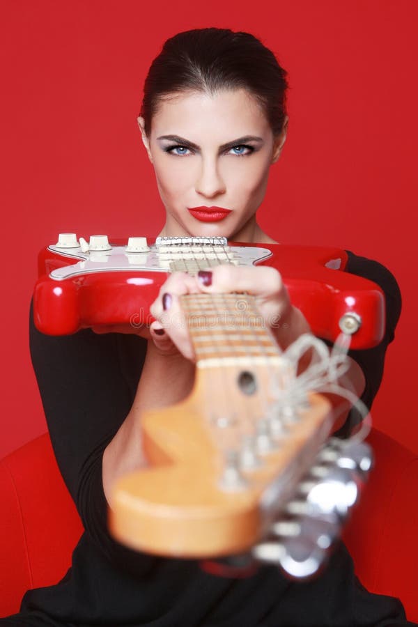 Woman on Red Background with Electric Guitar Stock Photo - Image of ...