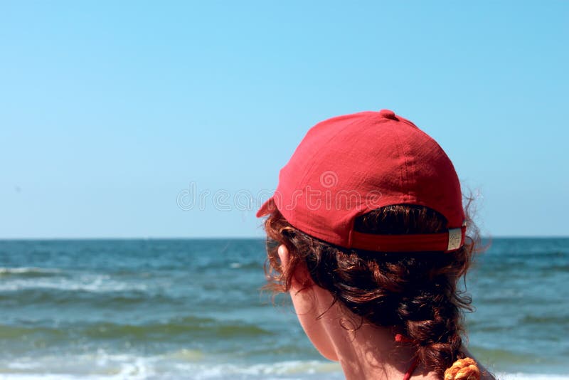 A woman in a red cap stock image. Image of summer, blue - 15246163