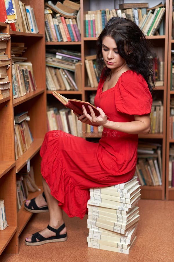 Woman in Red Dress in a Library Stock Image - Image of casual, book ...