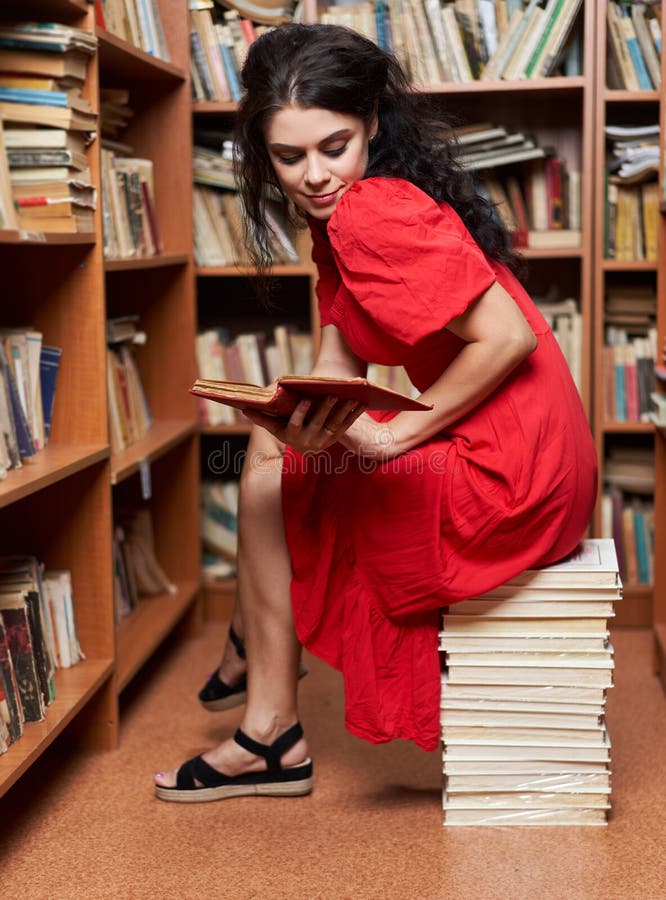 Woman in Red Dress in a Library Stock Image - Image of bookshelf ...