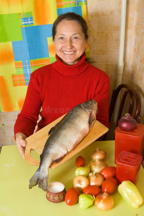 Woman with red fish stock image. Image of meat, food - 16463589