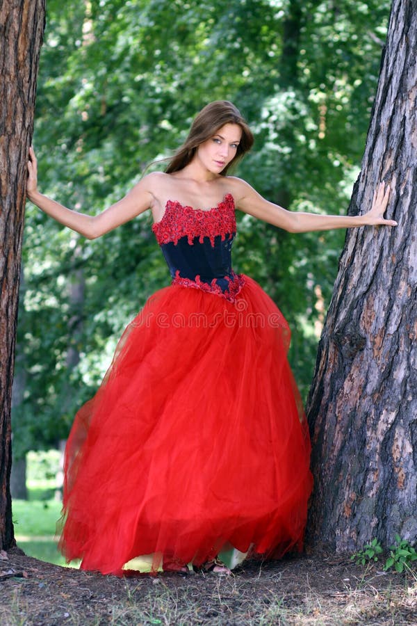 Woman in a Red Gothic Dress Stock Photo - Image of beautiful, nature ...