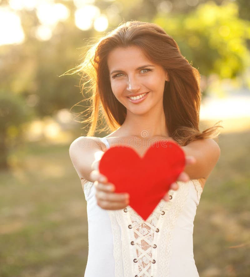 Woman with red heart stock photo. Image of attractive - 26417504