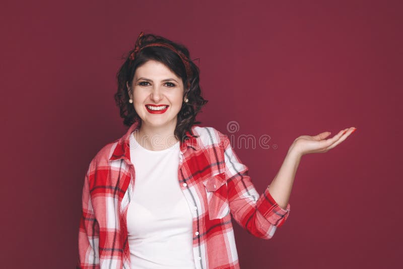 Woman with Red Lips Pointing Something in Colored Studio. Stock Photo ...