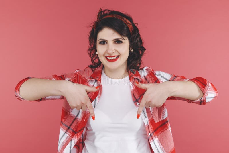 Woman with Red Lips Pointing Something in Colored Studio. Stock Image ...