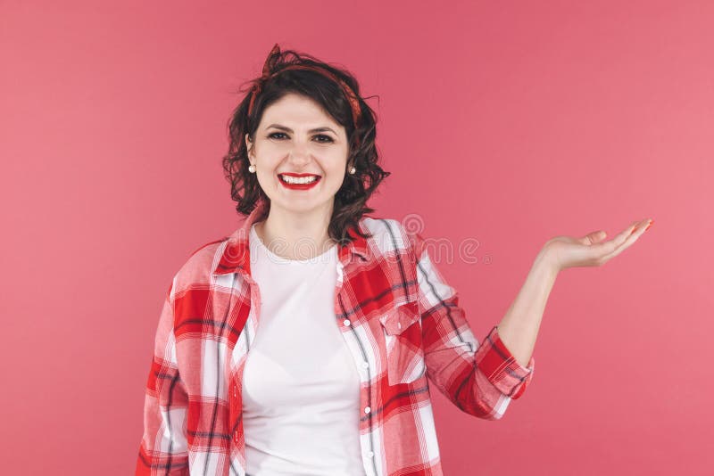 Woman with Red Lips Pointing Something in Colored Studio. Stock Image ...