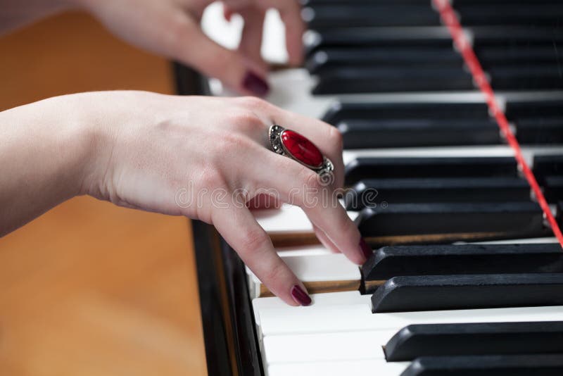 A Woman with Red Ring Playing Piano Stock Image - Image of pianist ...