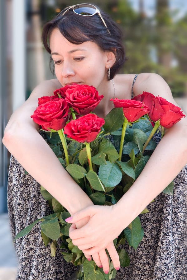 The woman with red roses stock image. Image of flower - 15530165