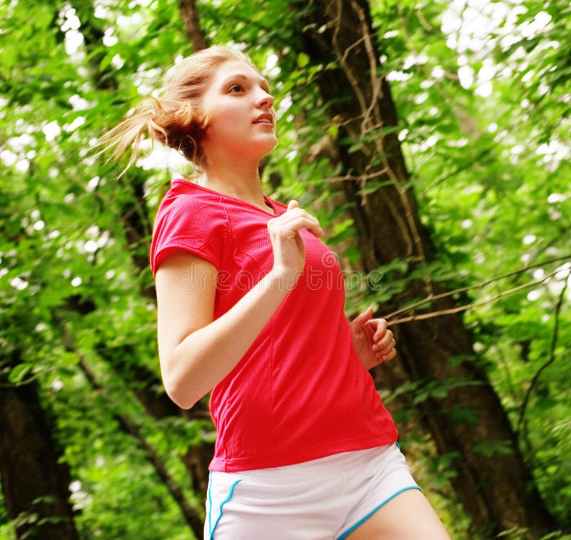 Woman in Red Running stock photo. Image of pretty, runner - 10083896