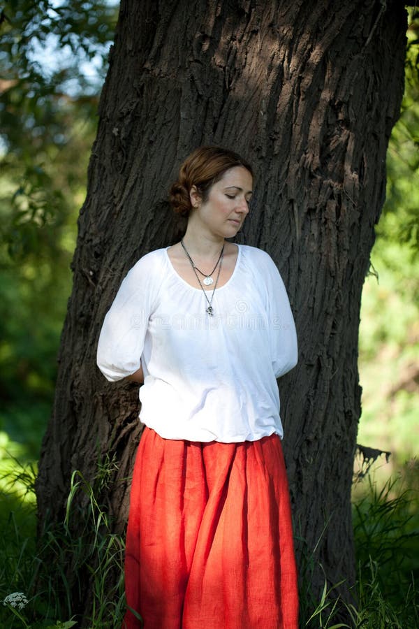 Woman in red sarafan stock image. Image of loneliness - 26129575