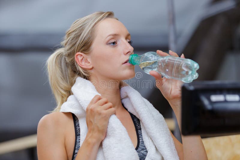 Woman Refreshing after Workout Stock Photo - Image of adult, female ...