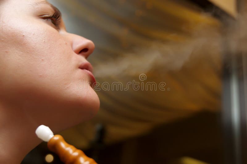 Woman relaxes with shisha stock image. Image of enjoyment - 6766177