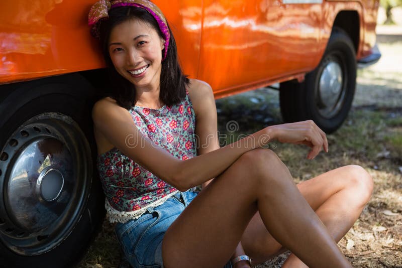 Woman Relaxing Against Camper Van in the Park Stock Image - Image of ...
