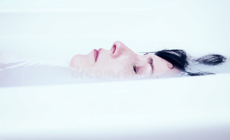 Woman relaxing in bath stock image. Image of bathtub - 145129541