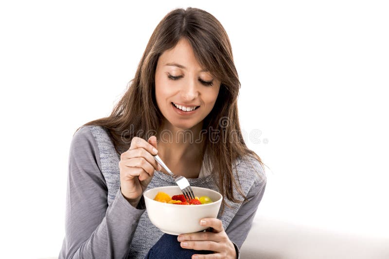 Woman relaxing and eating stock photo. Image of brunette - 59127542