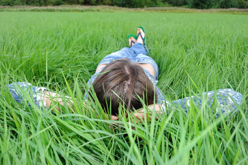 Woman relaxing in field stock photo. Image of resting - 15542368