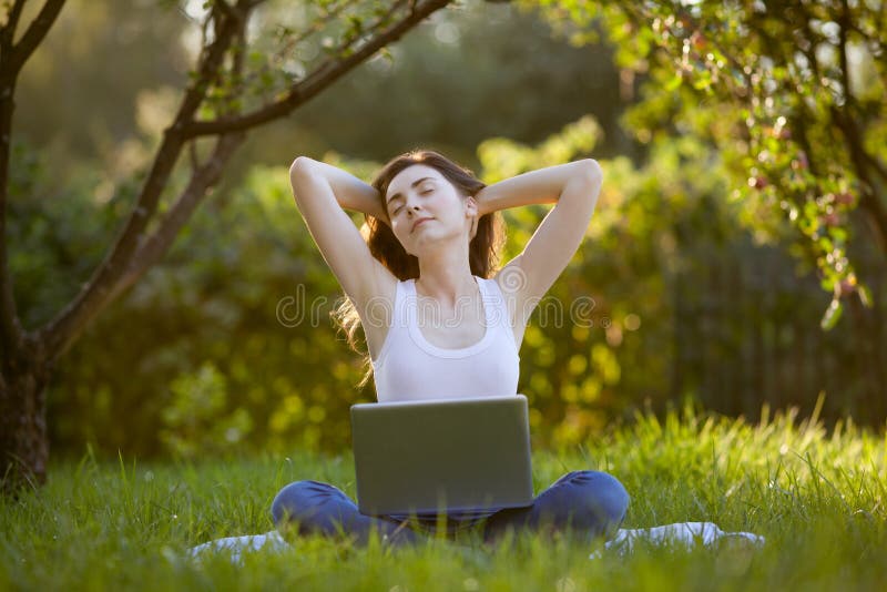Woman Relaxing with Laptop Outdoors Stock Photo - Image of calm, field ...