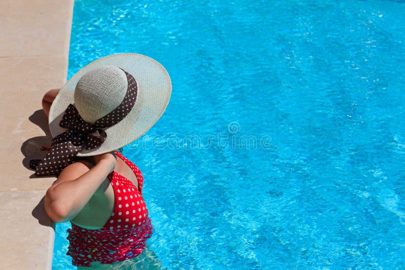 Woman relaxing at the pool stock photo. Image of fitness - 33021648