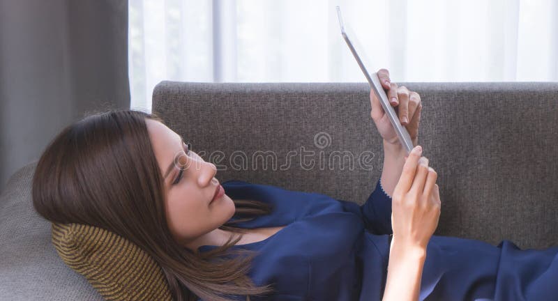 Woman is Relaxing and Reading Tablet Stock Image - Image of portrait ...