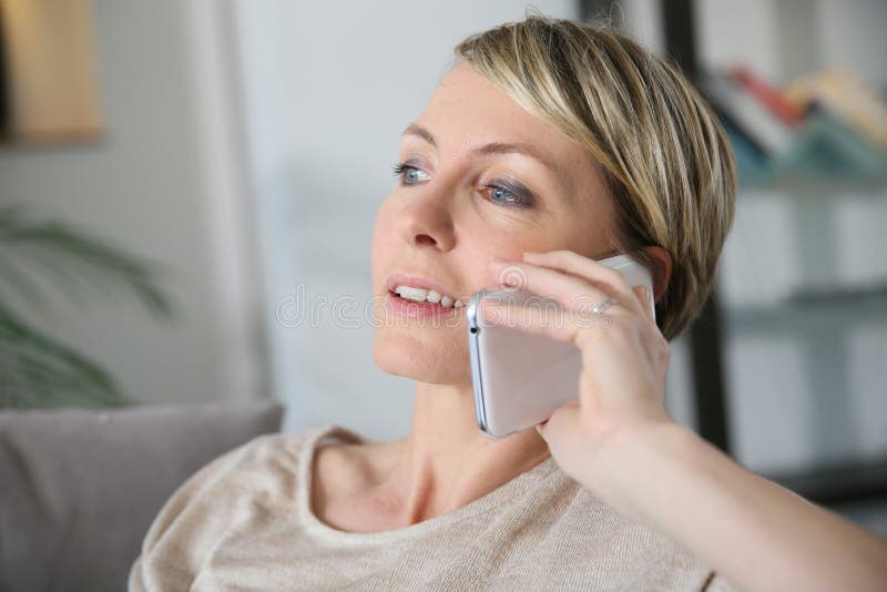 Woman Relaxing and Talking on Smartphone Stock Image - Image of ...