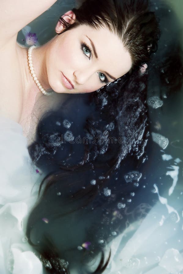 Woman relaxing in water stock image. Image of lady, clear - 24556505