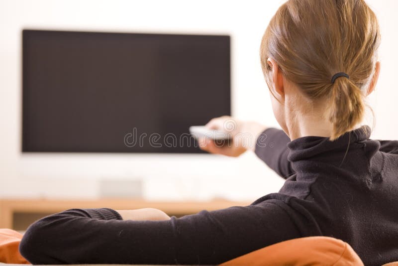 Woman with remote stock image. Image of hand, beautiful - 28254773