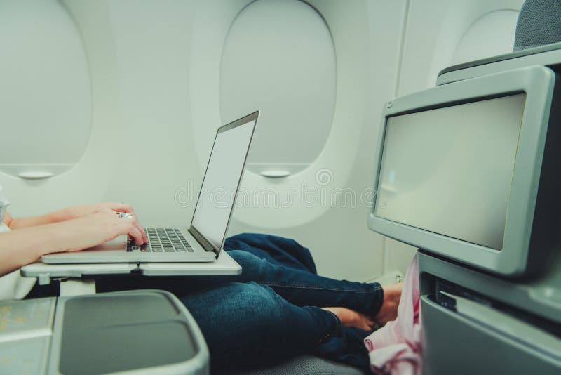 Woman Remotely Working while in Airplane Business Class Stock Image ...