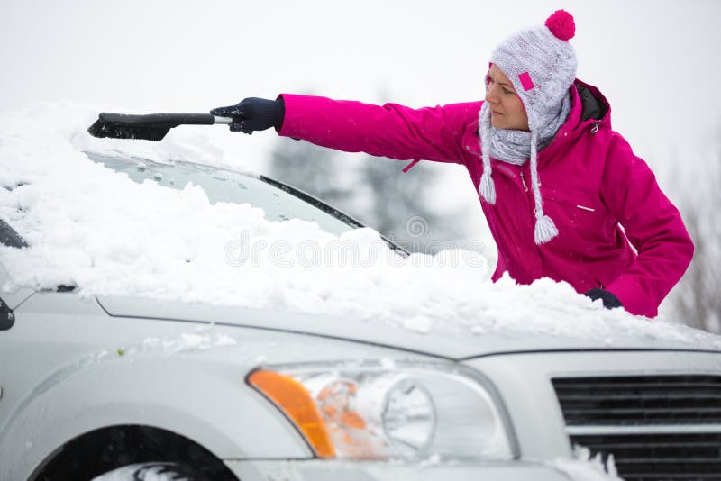 Woman Removing Snow from Car Stock Photo - Image of scratching, cold ...