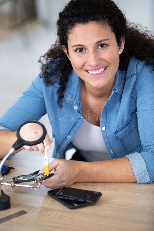 Woman Repairing Broken Smartphone in Workshop Stock Image - Image of ...