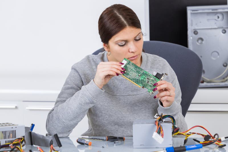 Woman repairing computer stock photo. Image of woman - 173510950