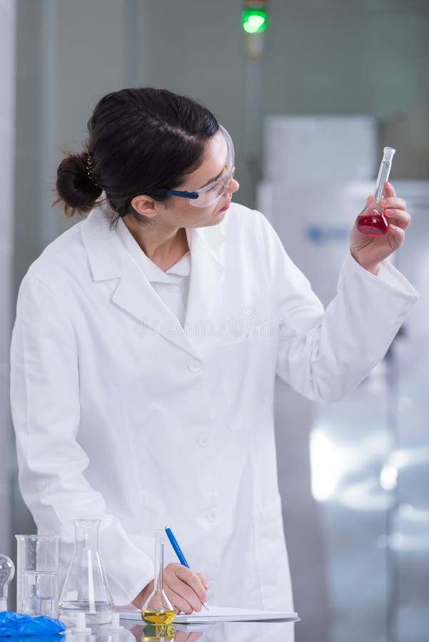 Woman Researcher Doing a Lab Test and Making Notes Stock Photo - Image ...