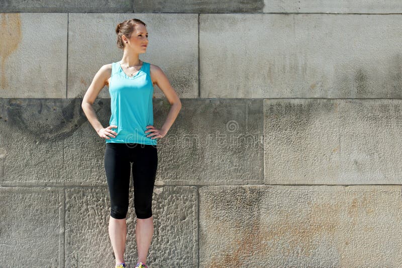 Woman Resting after Run by the Wall Urban. Stock Photo - Image of knee ...