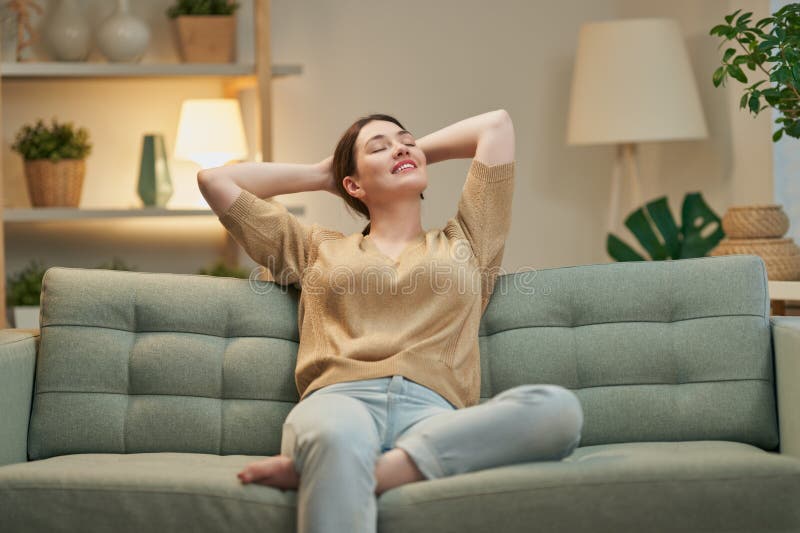 Woman resting on sofa stock photo. Image of perfect - 165644088