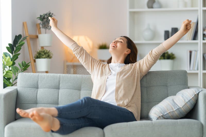 Woman resting on a sofa stock photo. Image of perfect - 246476312