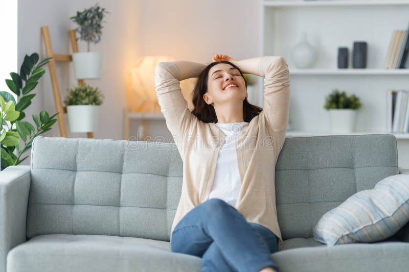 Woman resting on a sofa stock photo. Image of confident - 248846606