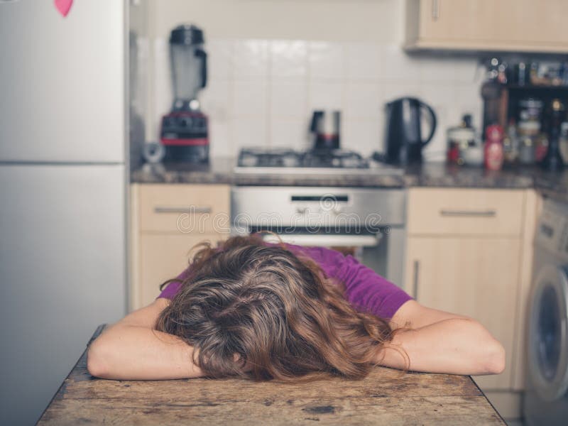 Woman Resting at Table in Kitchen Stock Image - Image of wooden ...