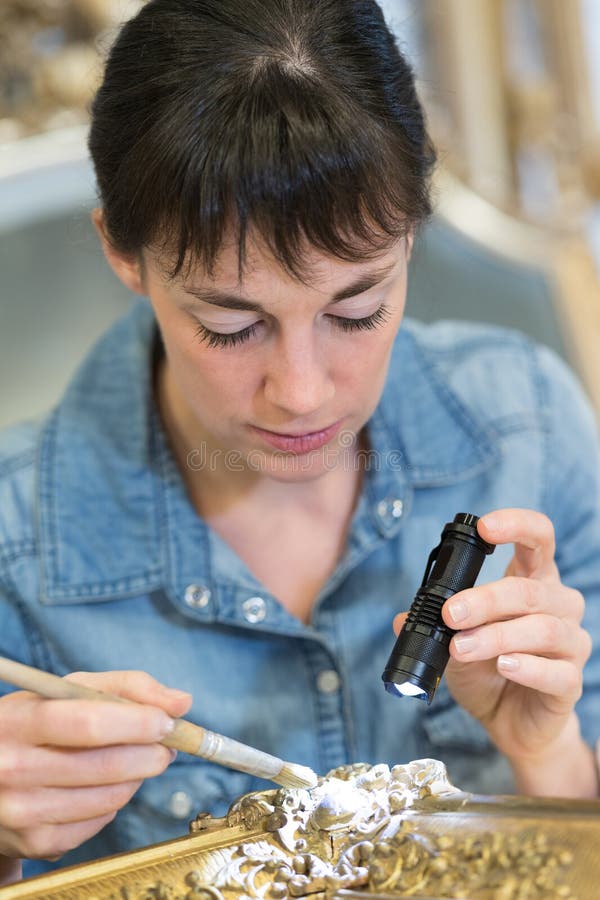 Woman restoring frame stock photo. Image of beauty, clean - 284465722