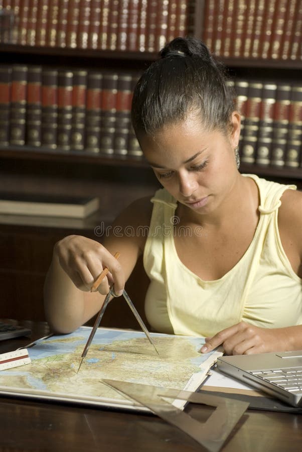 Woman Reviews Map with Compass - Vertical Stock Image - Image of ...