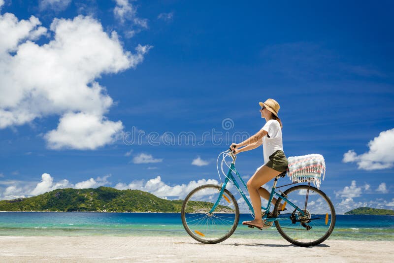 Woman ride along the Beach stock image. Image of ocean - 85093337
