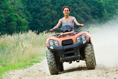 Woman riding ATV stock photo. Image of driving, power - 5604980