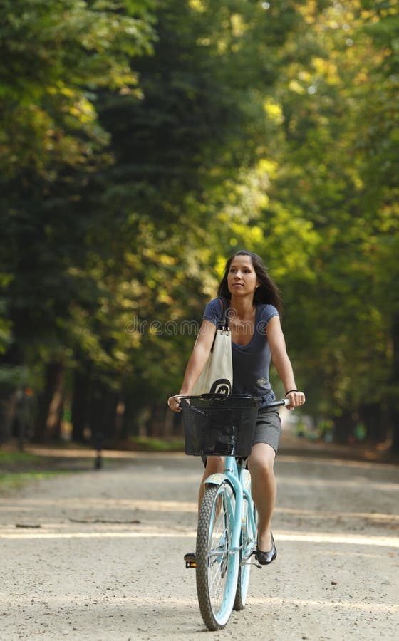 Woman Riding a Bicycle stock image. Image of adult, active - 12387243