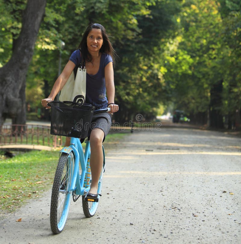 Woman Riding a Bicycle stock image. Image of adult, active - 12387243